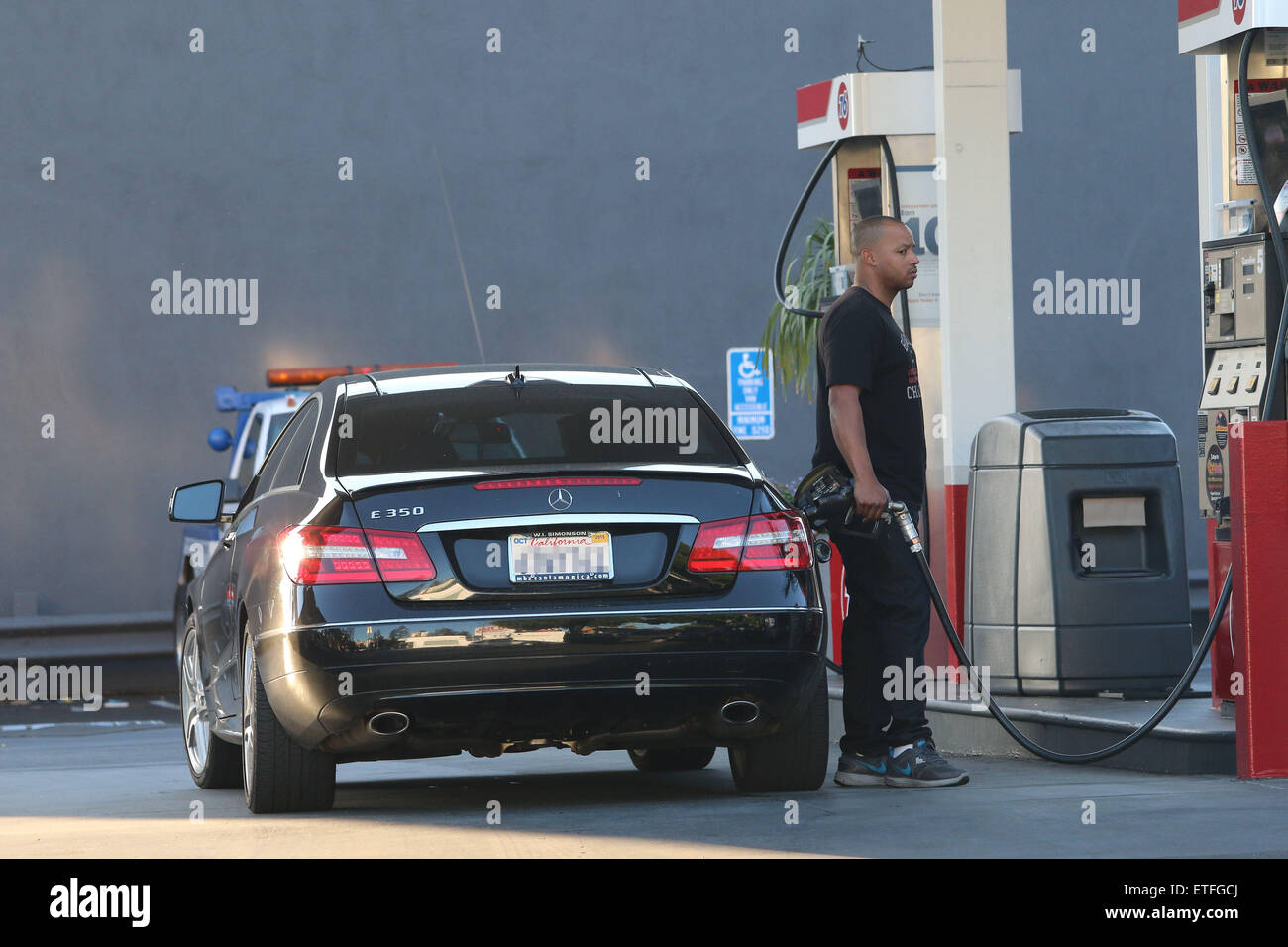 Scrubs actor Donald Faison pumping gas in his Mercedes in West ...