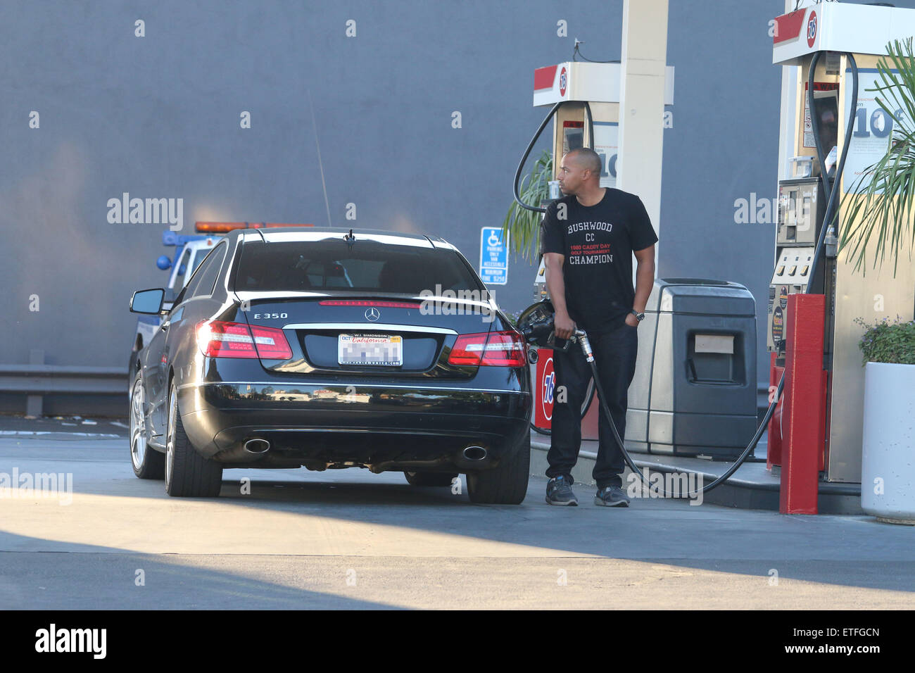 Scrubs actor Donald Faison pumping gas in his Mercedes in West ...