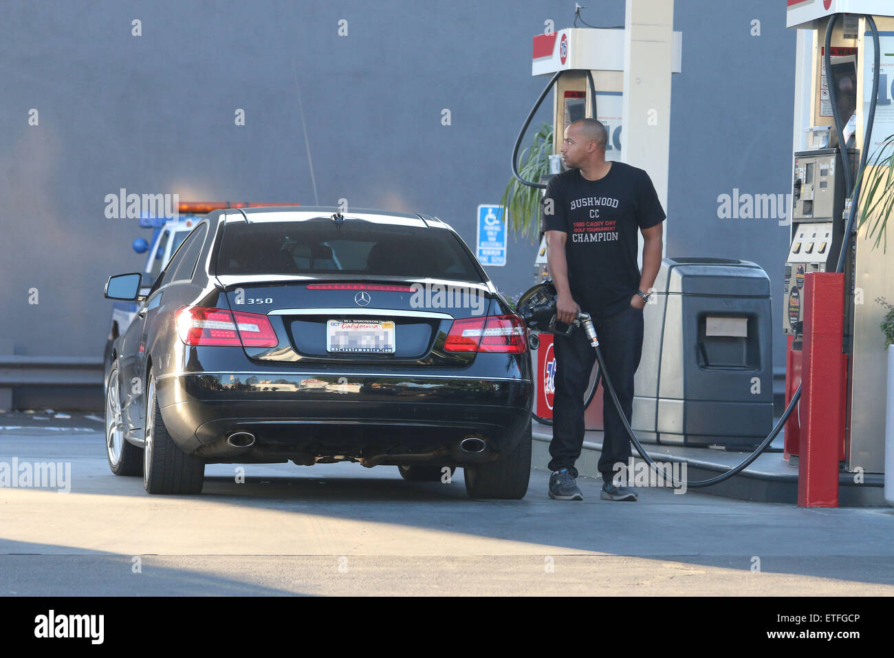 Scrubs actor Donald Faison pumping gas in his Mercedes in West ...