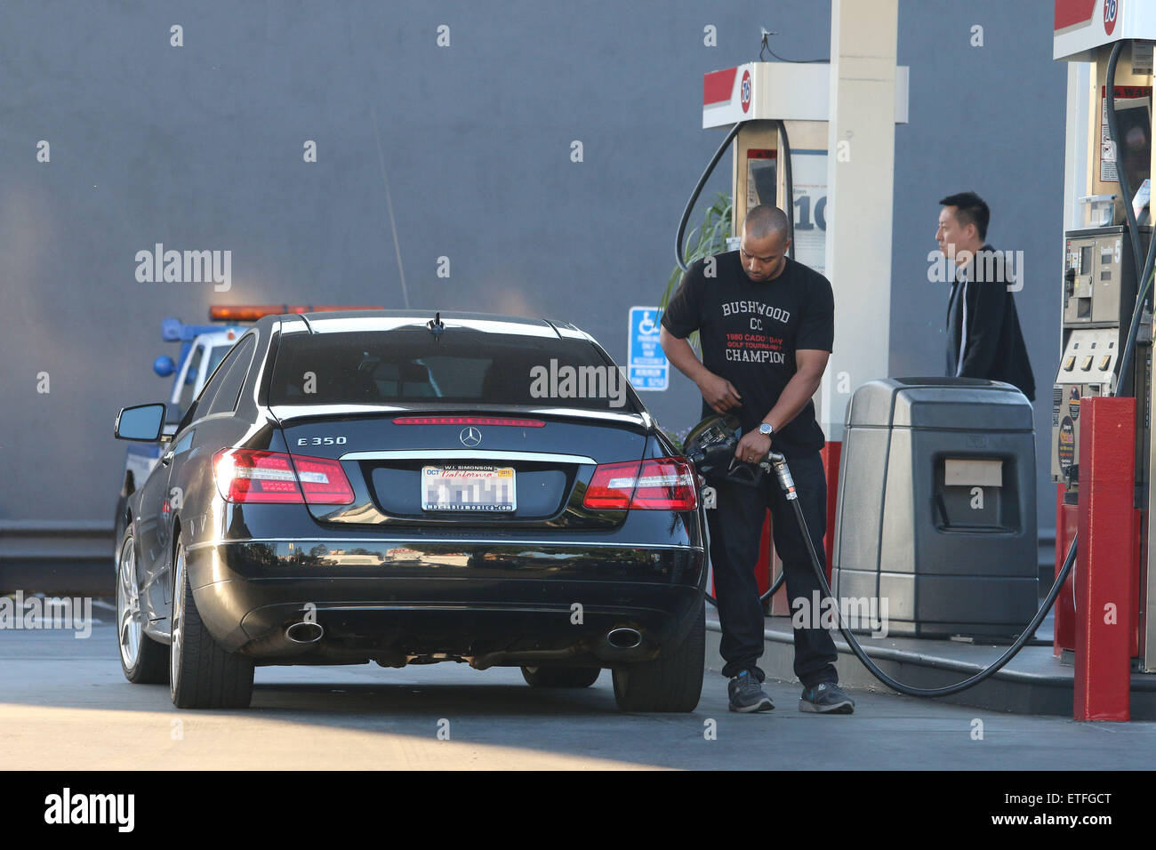 Scrubs actor Donald Faison pumping gas in his Mercedes in West ...