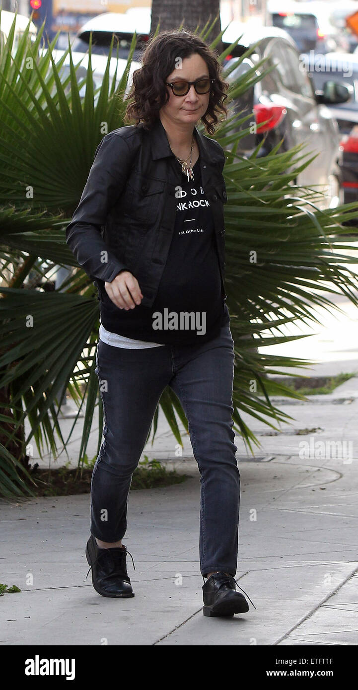 Heavily pregnant Sara Gilbert taking some long strides as she walks ...