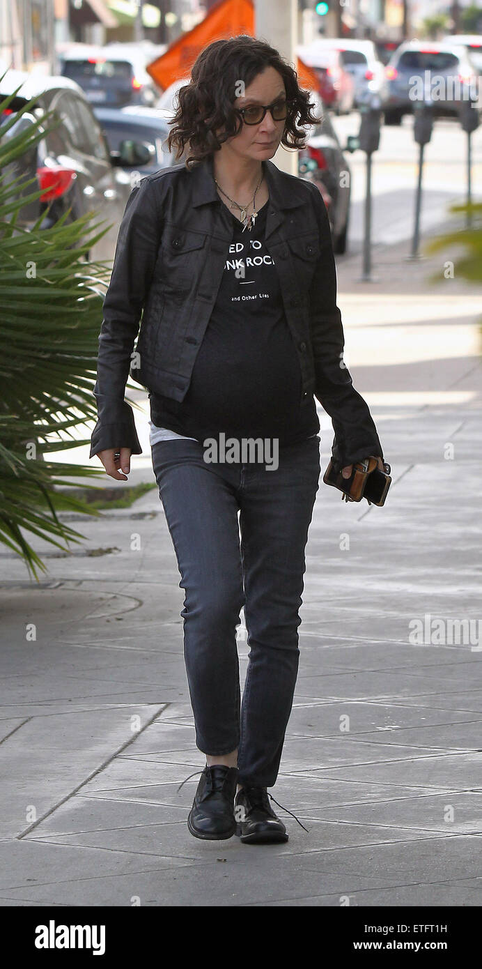 Heavily pregnant Sara Gilbert taking some long strides as she walks ...