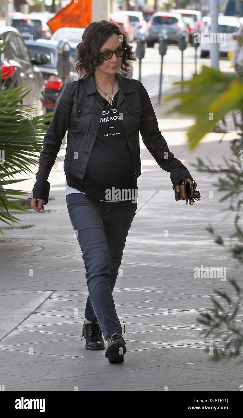 Heavily pregnant Sara Gilbert taking some long strides as she walks ...