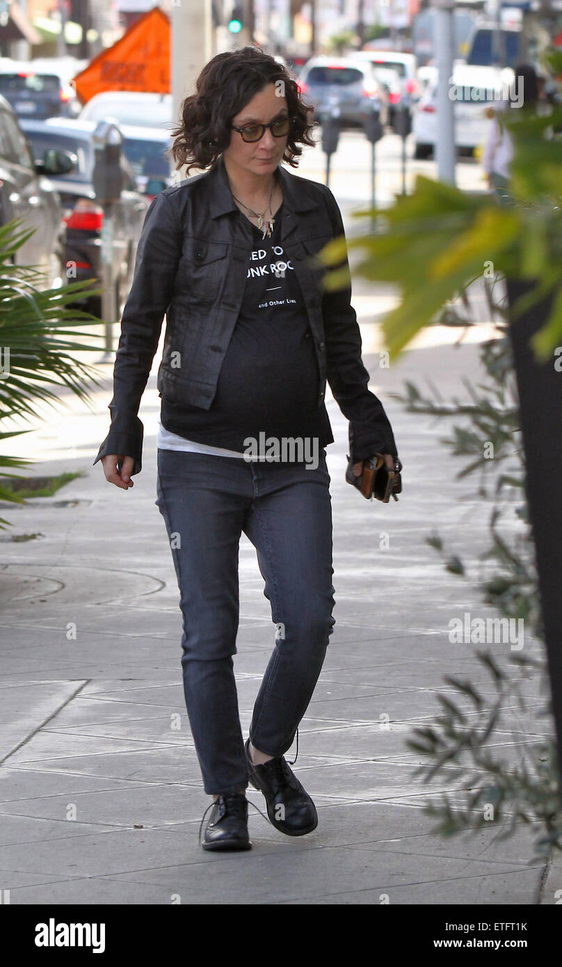 Heavily pregnant Sara Gilbert taking some long strides as she walks ...