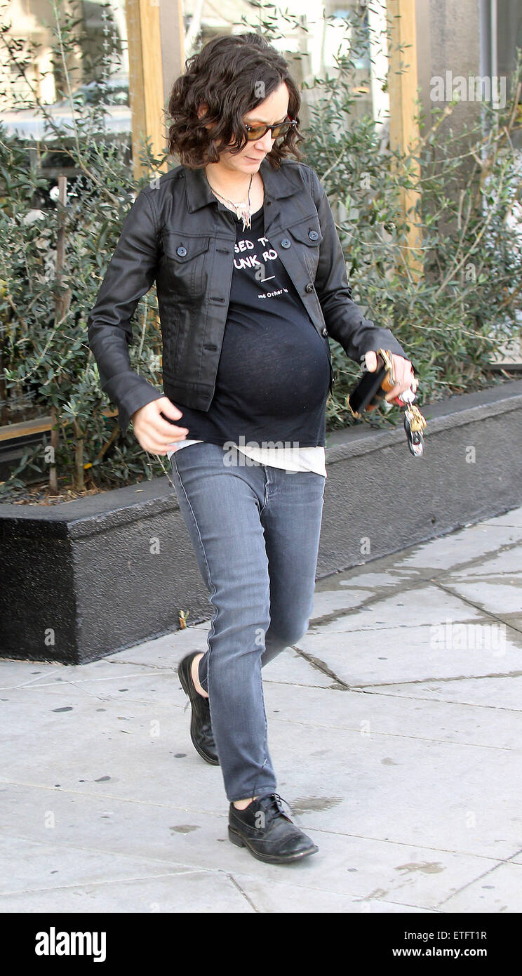 Heavily pregnant Sara Gilbert taking some long strides as she walks ...