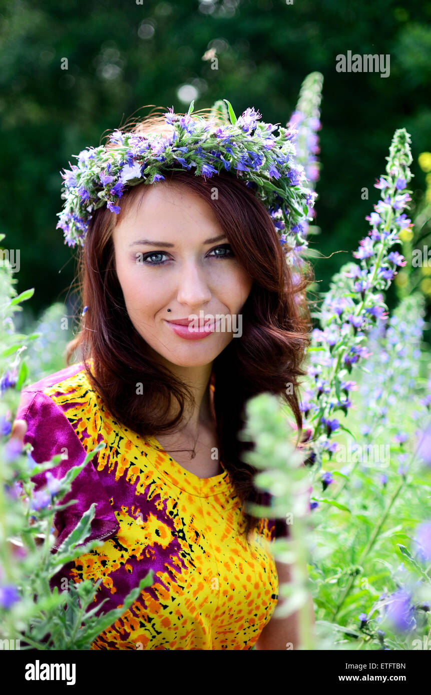 Beautiful girl from Poland with wreath made of flowers. Portrait of ...
