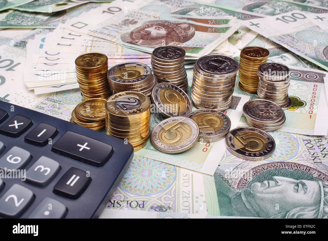 Polish money and calculator on money background Stock Photo - Alamy