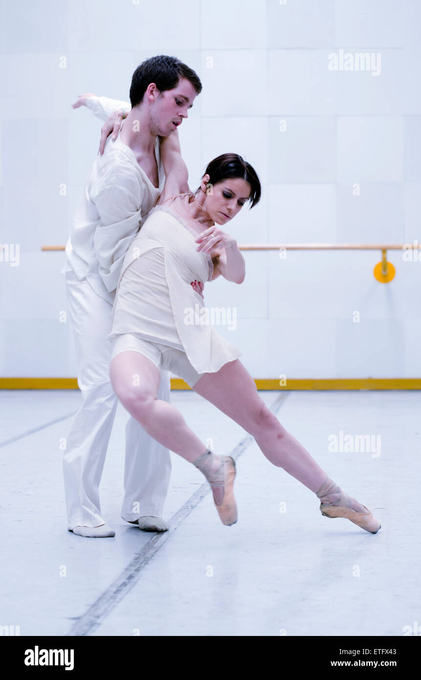 Ballet dancers in white, practicing choreography Stock Photo - Alamy