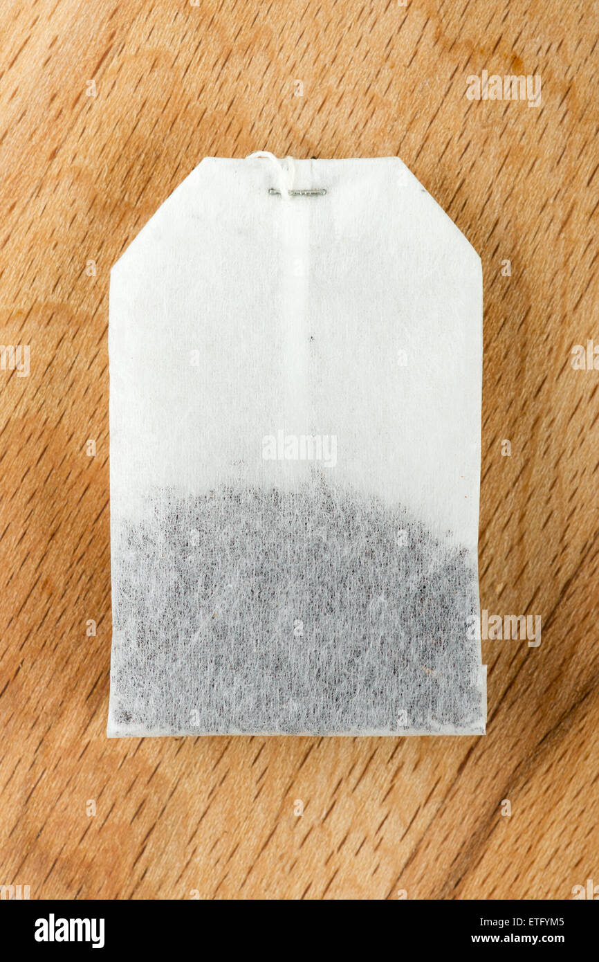 Teabag on wooden background Stock Photo - Alamy