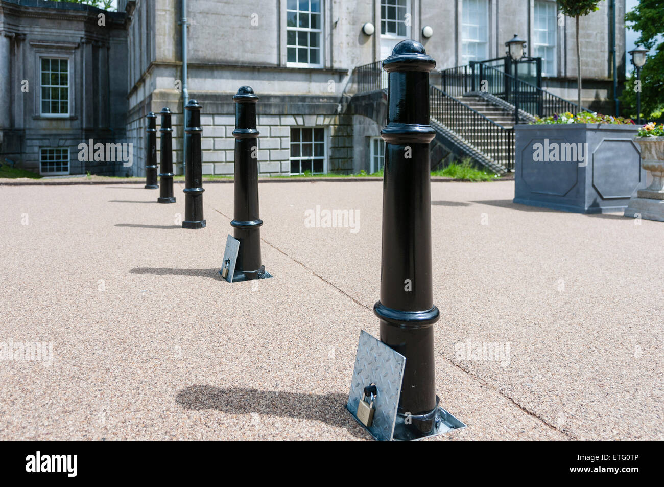 Removable traffic bollards with padlocks Stock Photo - Alamy