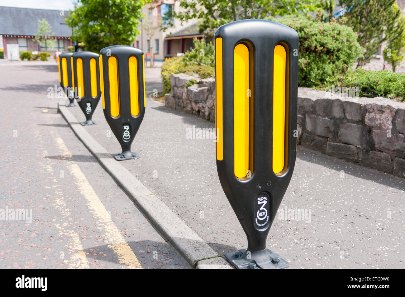 Bollards on a footpath, to prevent cars parking Stock Photo - Alamy