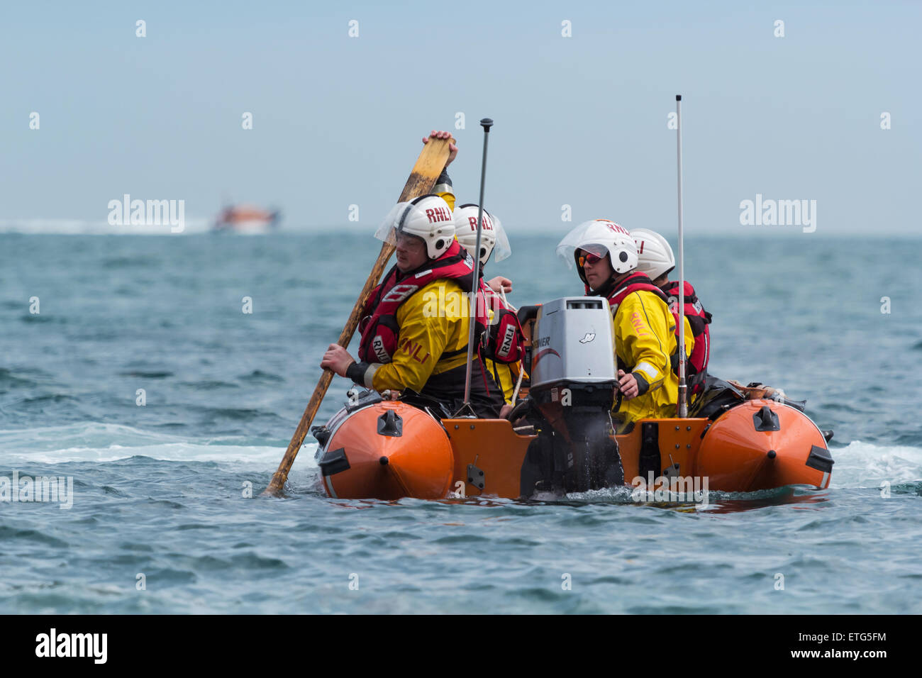 Lifeboat crew in their speedboat on sea during a search and rescue ...