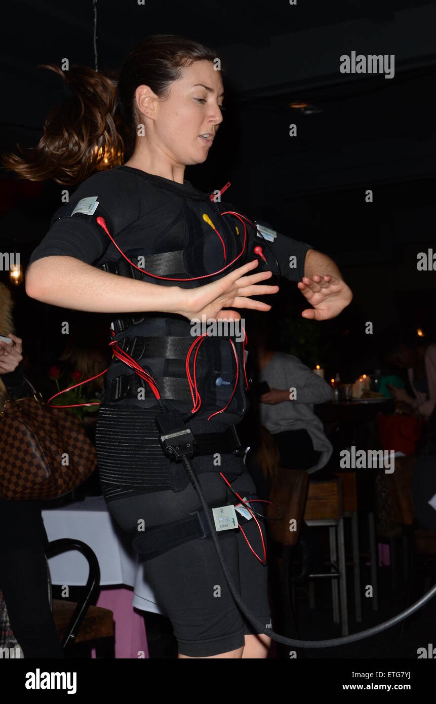 A demonstration of an electric fat-burning jacket at the Beauty ...