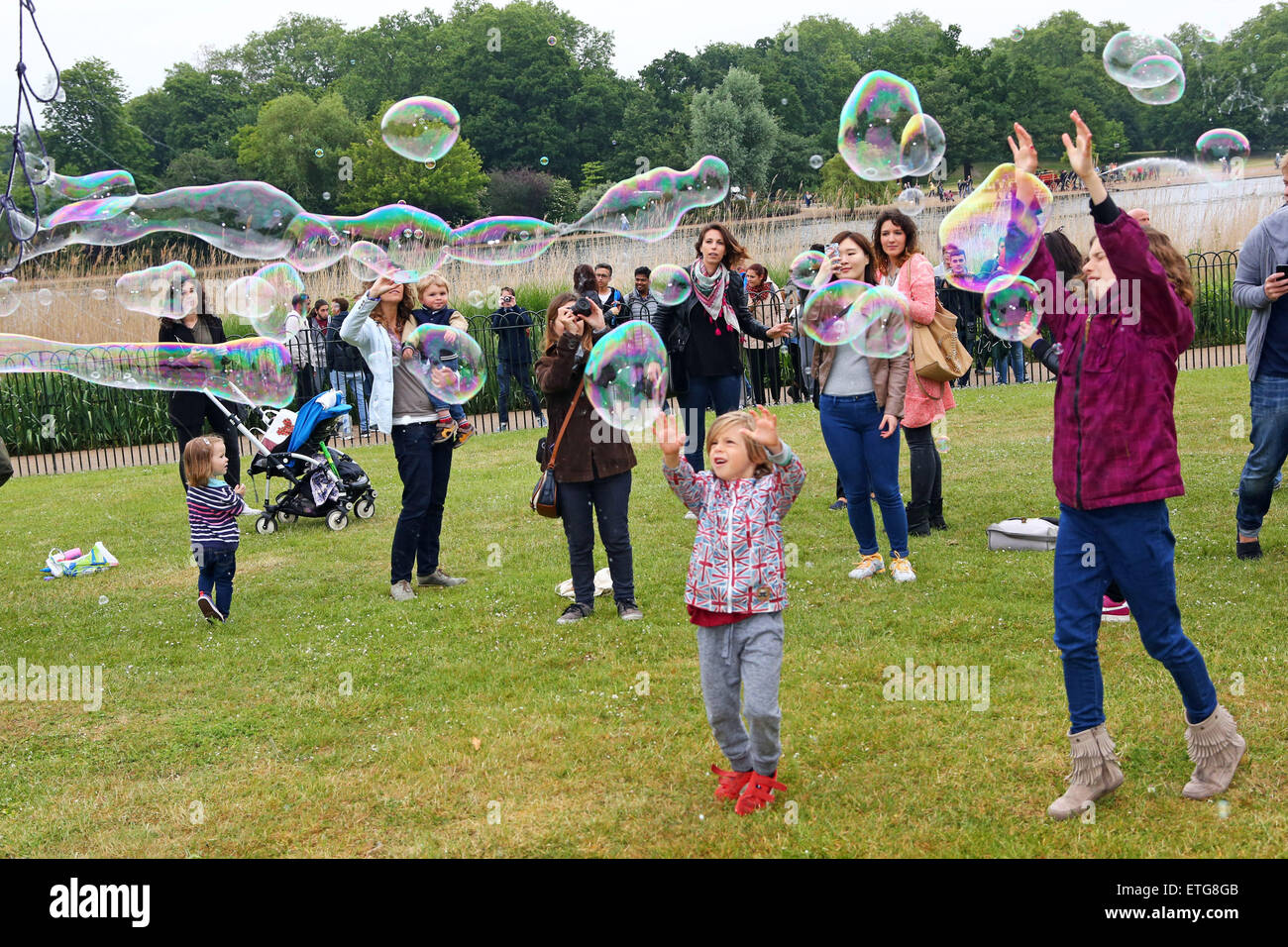 London, UK. 13th June 2015. People blowing bubbles at the LON-BUBBLE ...