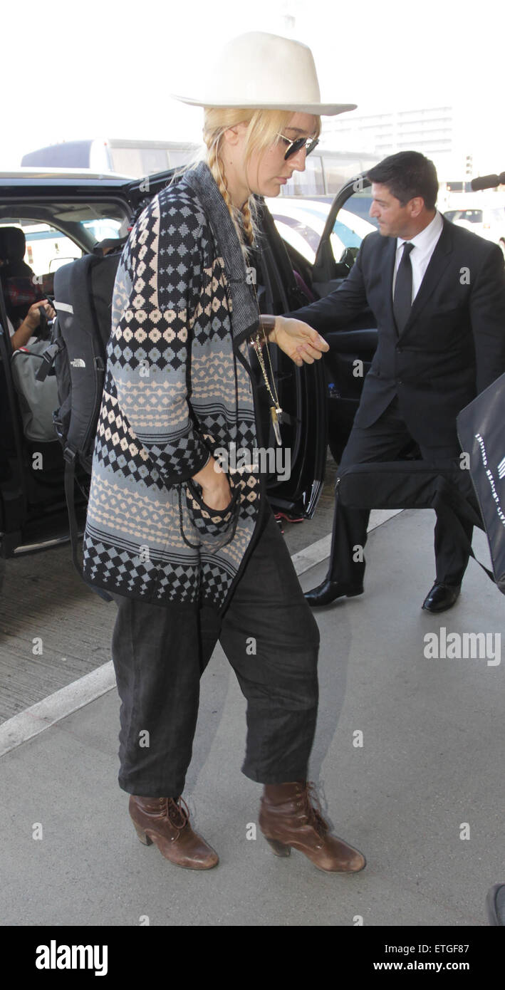 Ruby Stewart wearing an oversized tribal pattern cardigan and scruffy ...