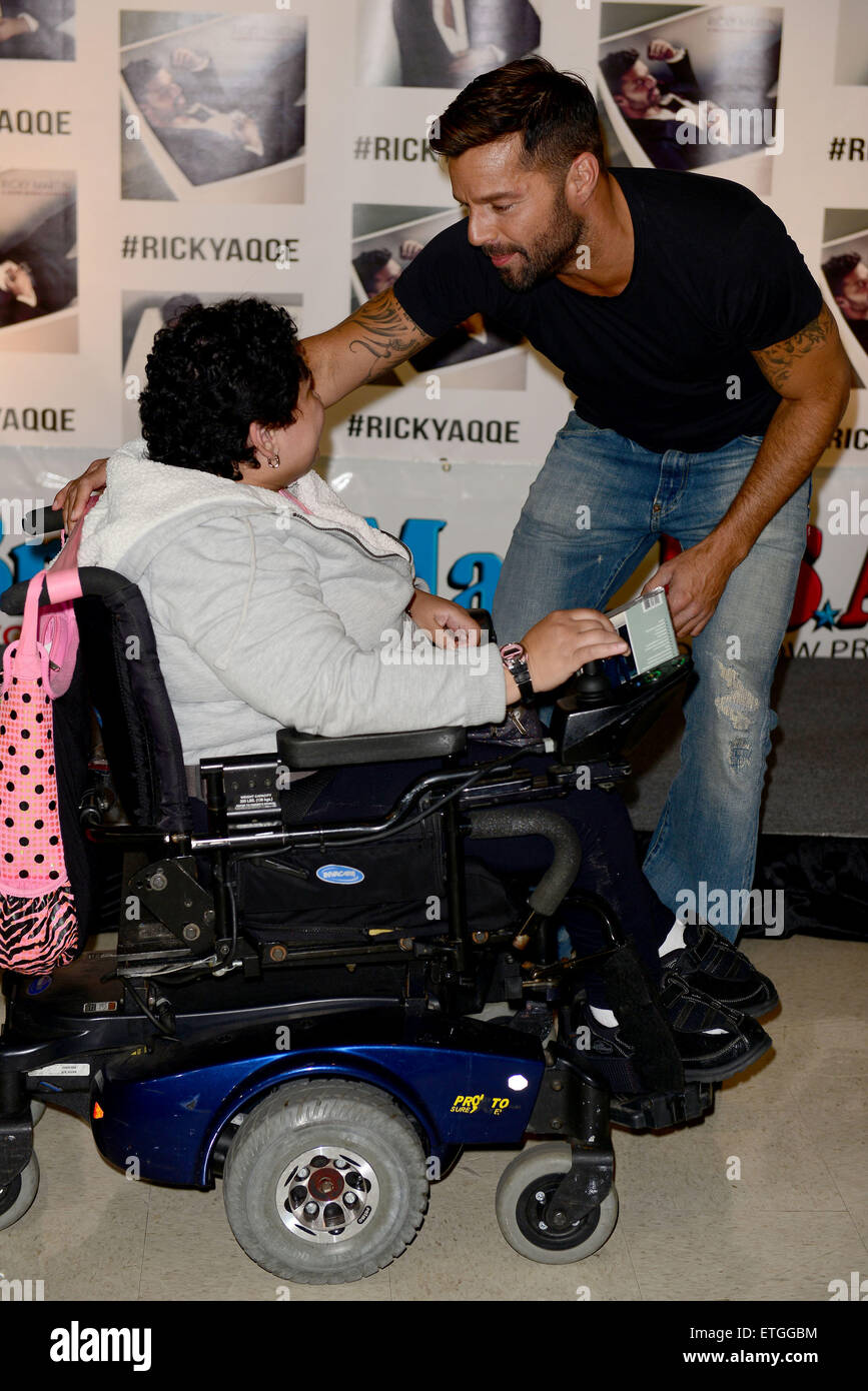 Ricky Martin meets and greets fans at BrandsMart USA signing his new CD ...