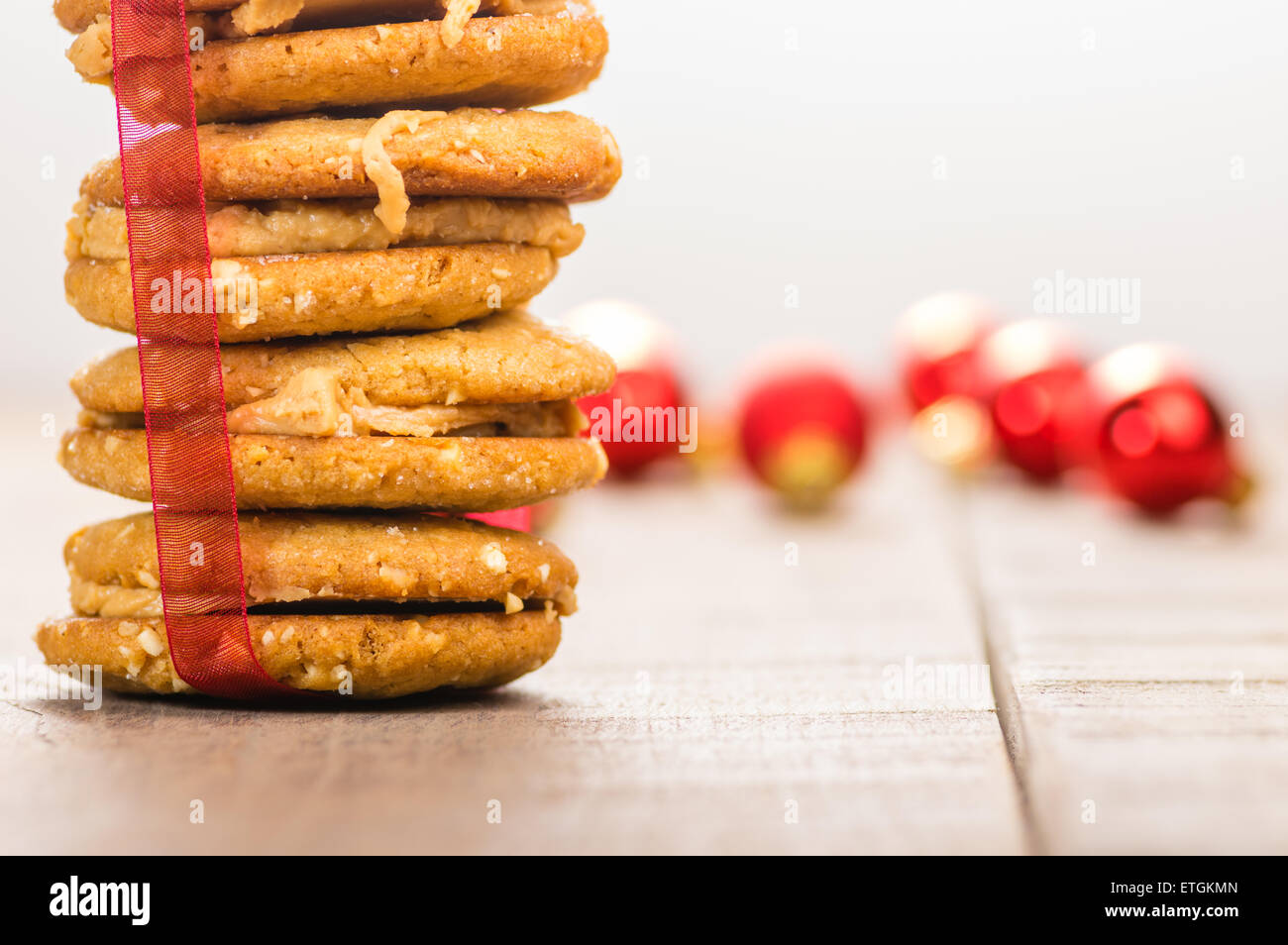 A stack of Christmas cookies tied up with red ribbon Stock Photo - Alamy