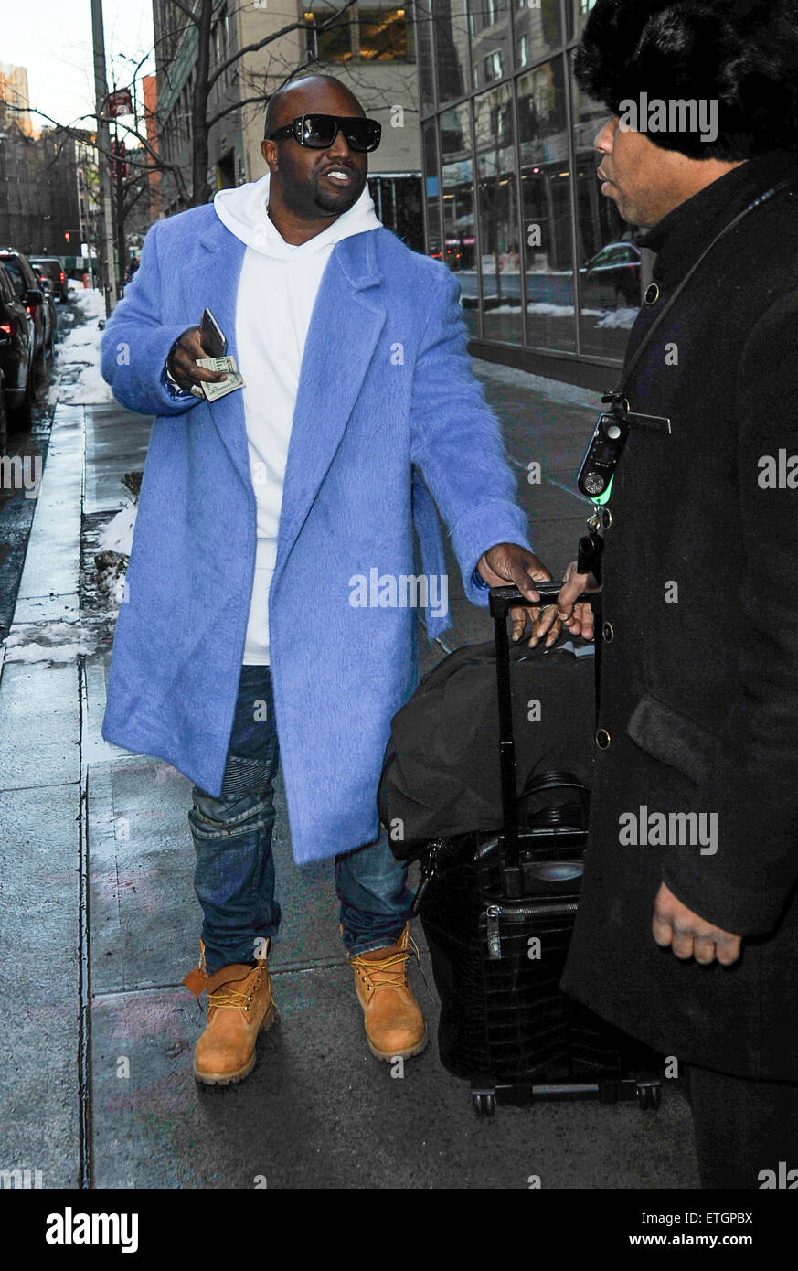 Singer Rico Love talking on his cellphone outside of his hotel in New ...