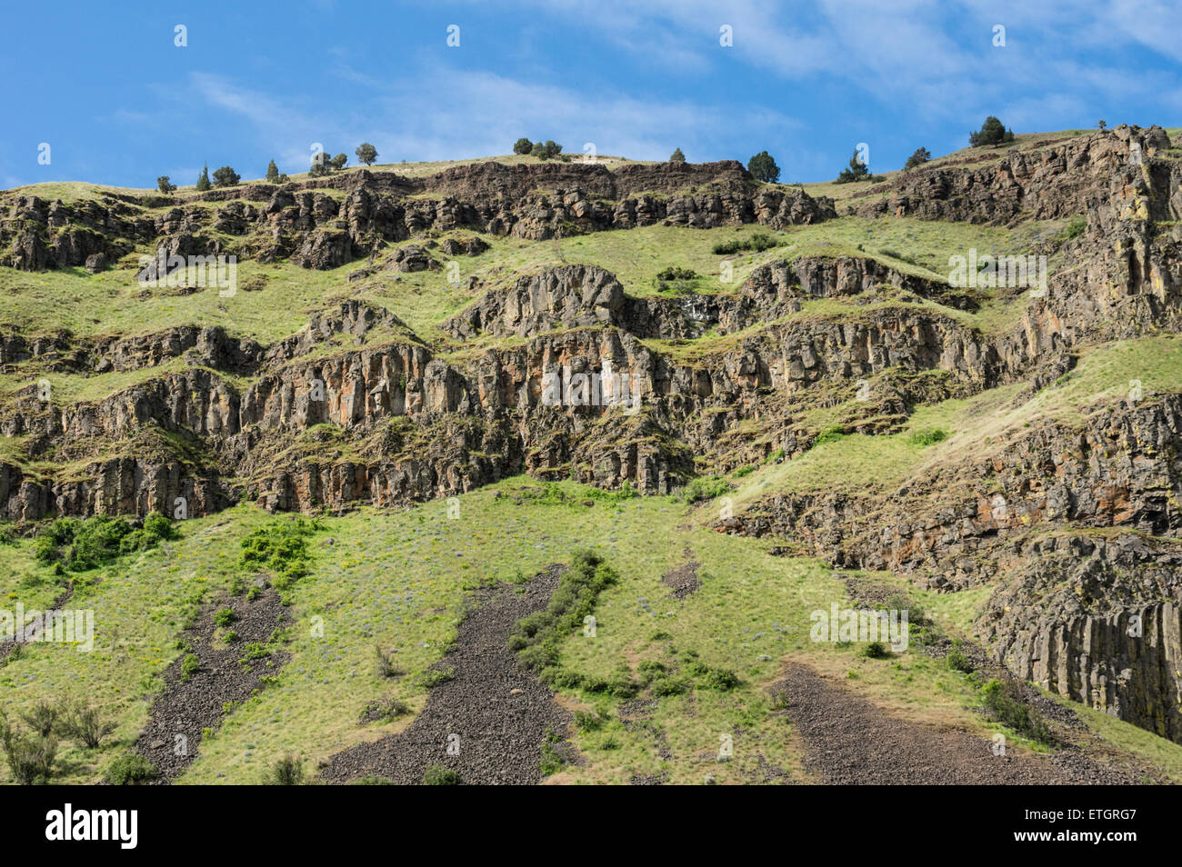 Rocky volcanic outcrop with steep slopes Stock Photo - Alamy