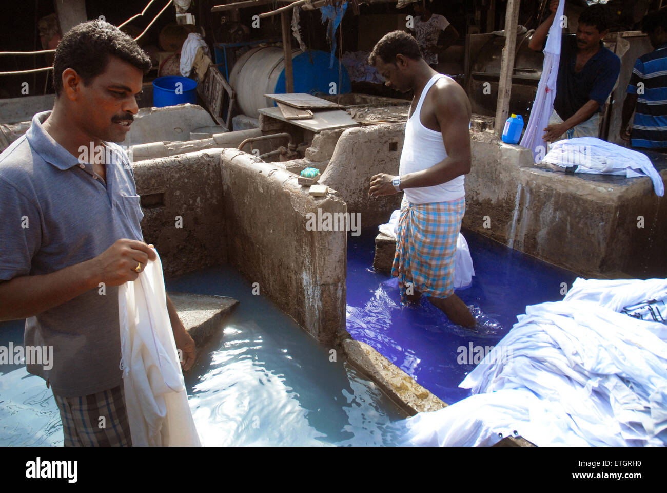 Men washing clothes at Mahalaxmi Dhobi Ghat open air laundromat, Mumbai ...