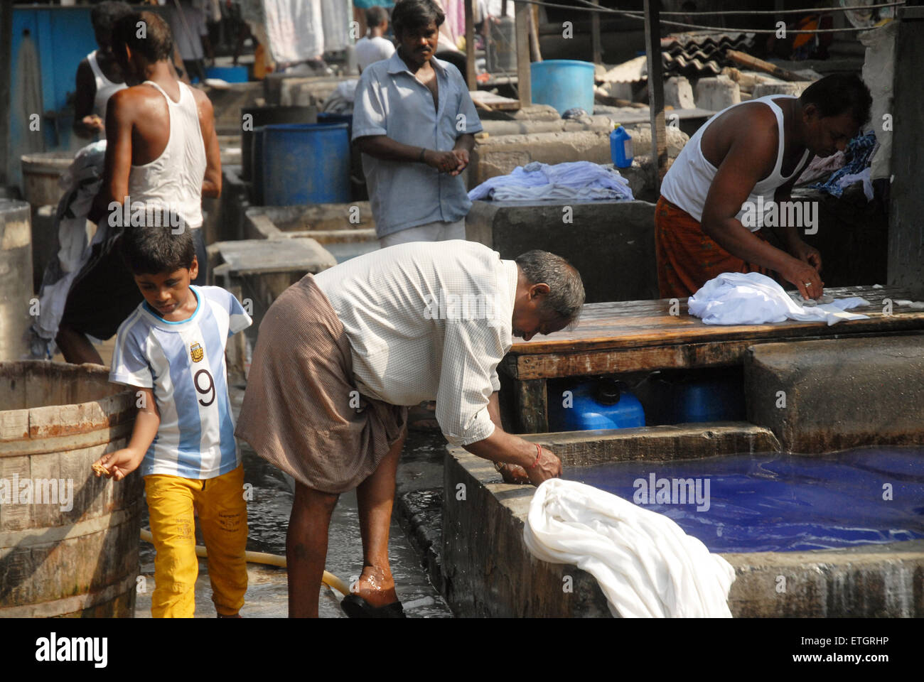Men washing clothes at Mahalaxmi Dhobi Ghat open air laundromat, Mumbai ...