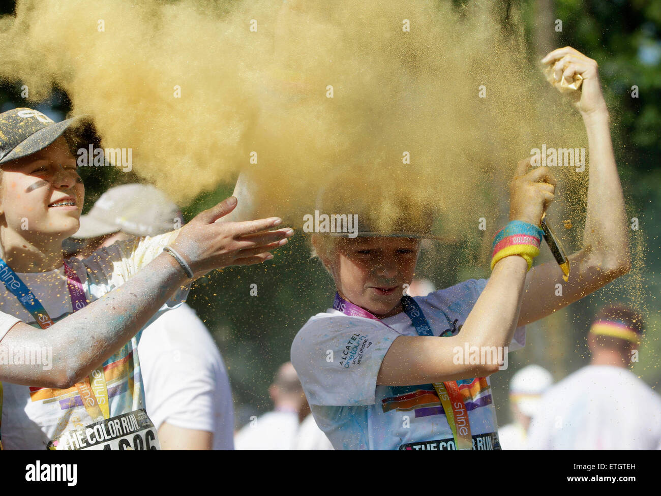 Vancouver, Canada. 13th June, 2015. Runners spray colour powder to each ...