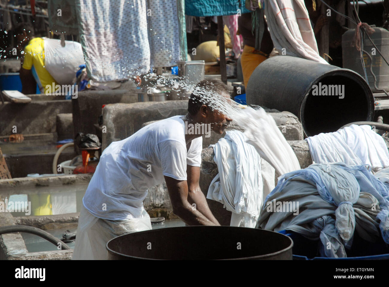 Men washing clothes at Mahalaxmi Dhobi Ghat open air laundromat, Mumbai ...