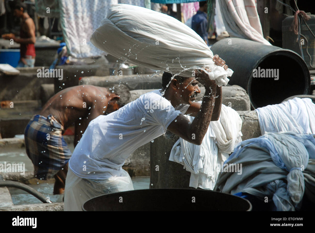 Men washing clothes at Mahalaxmi Dhobi Ghat open air laundromat, Mumbai ...