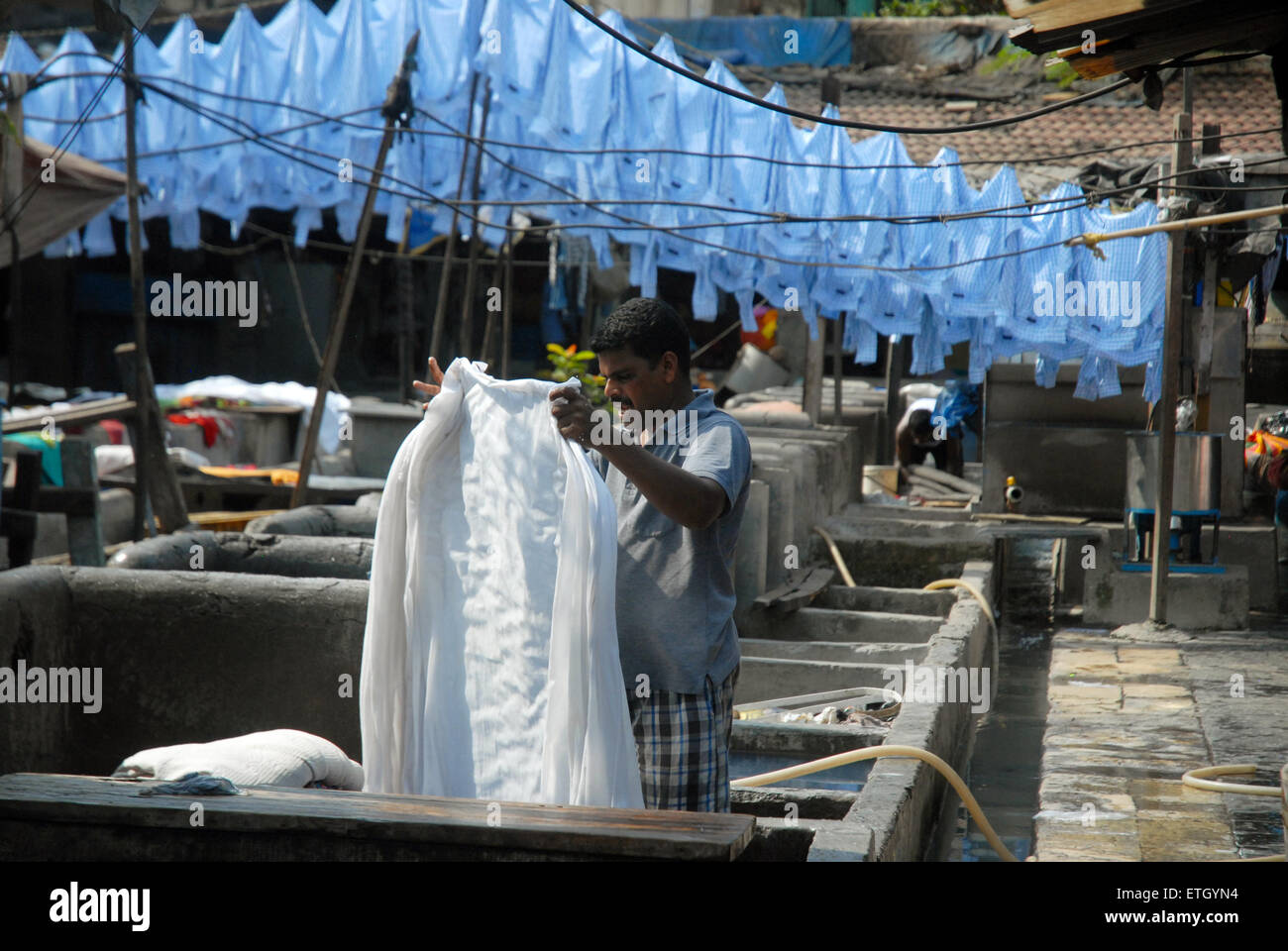 Men washing clothes at Mahalaxmi Dhobi Ghat open air laundromat, Mumbai ...