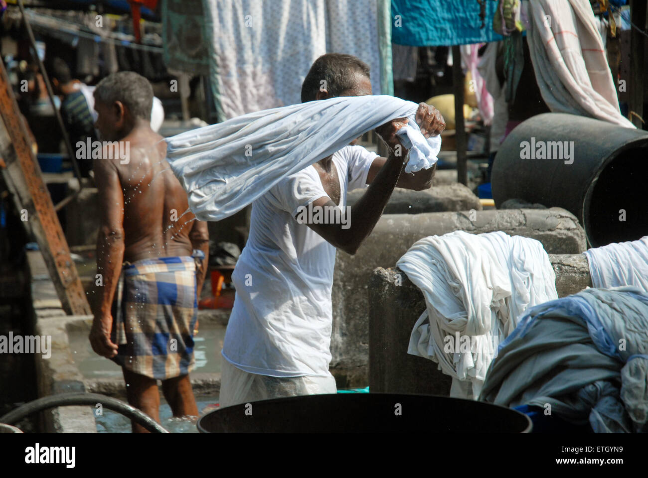 Men washing clothes at Mahalaxmi Dhobi Ghat open air laundromat, Mumbai ...