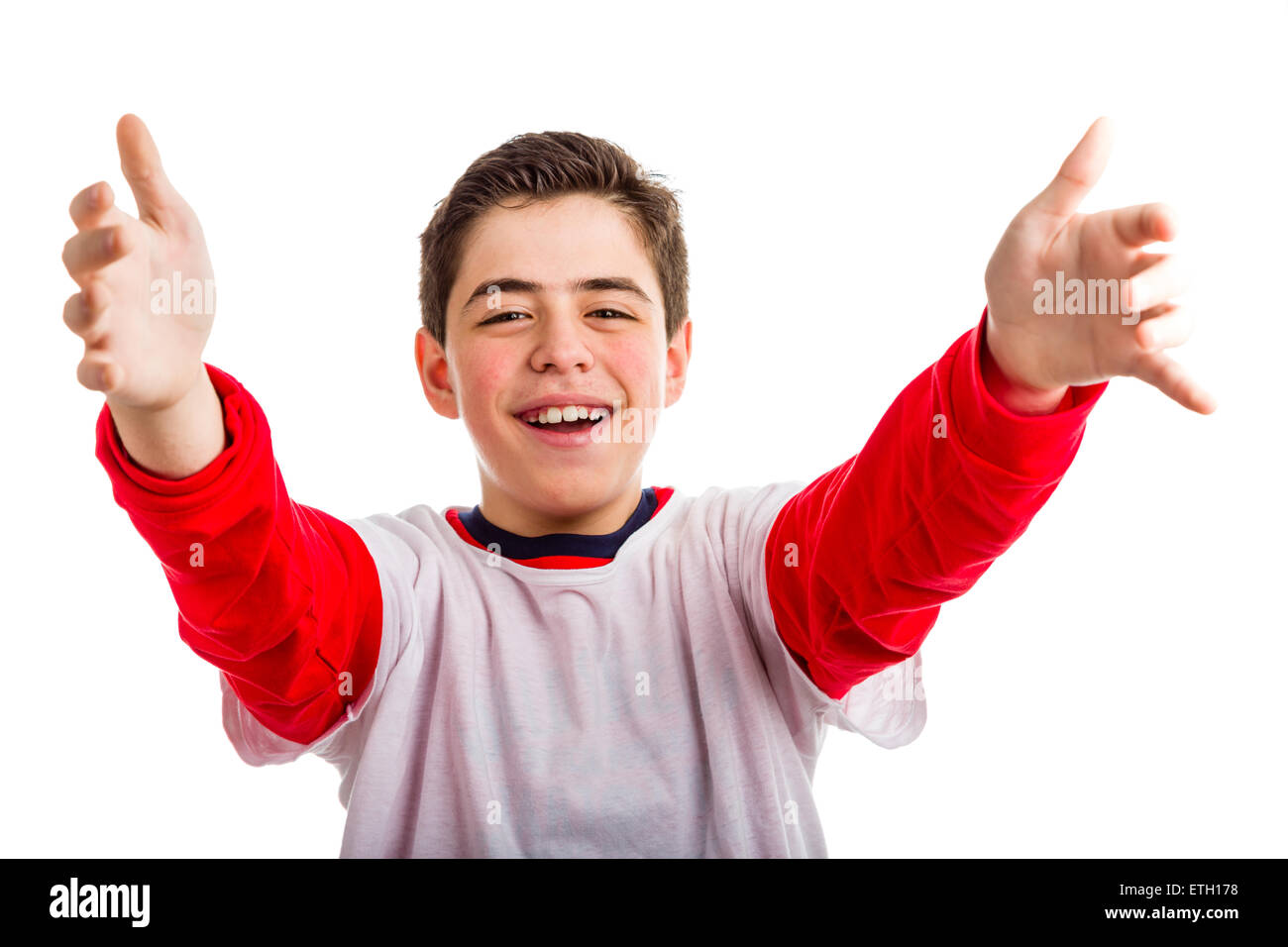 A cute Caucasian boy offers a hug outstretching arms to viewer. He ...