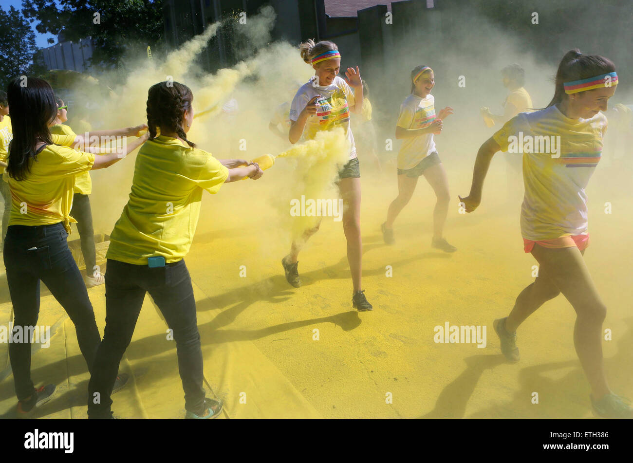 Vancouver, Canada. 13th June, 2015. Runners are sprayed with colour ...