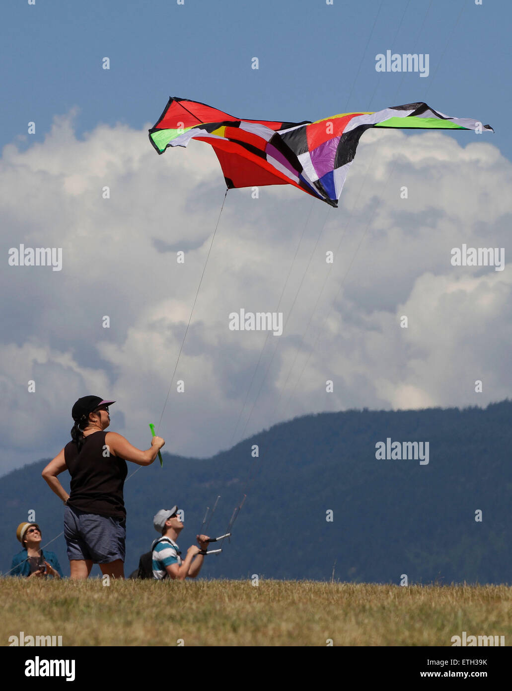 Vancouver, Canada. 13th June, 2015. A kite enthusiast demonstrates her ...