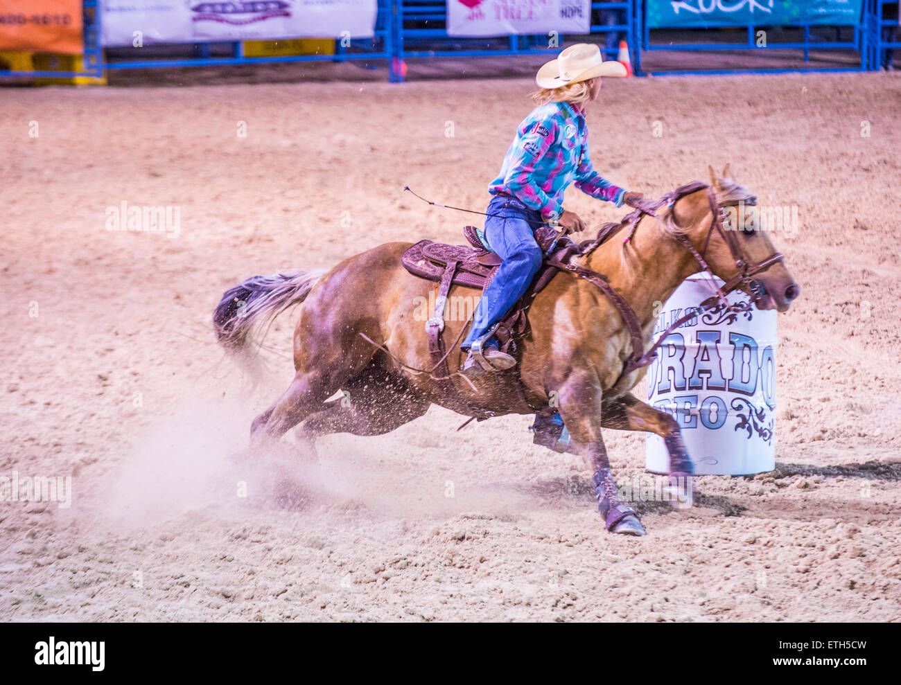 Cowgirl Participating in a Barrel racing competition at the Helldorado ...