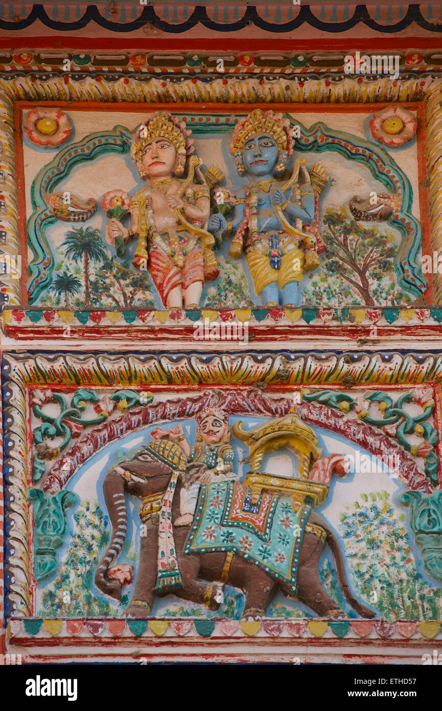 Painted bas relief on a wall in Pushkar. Indian deities. Rajasthan ...