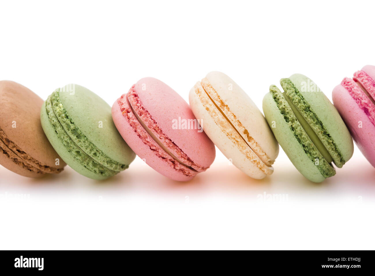 colorful macaroons line up on white with clipping path Stock Photo - Alamy