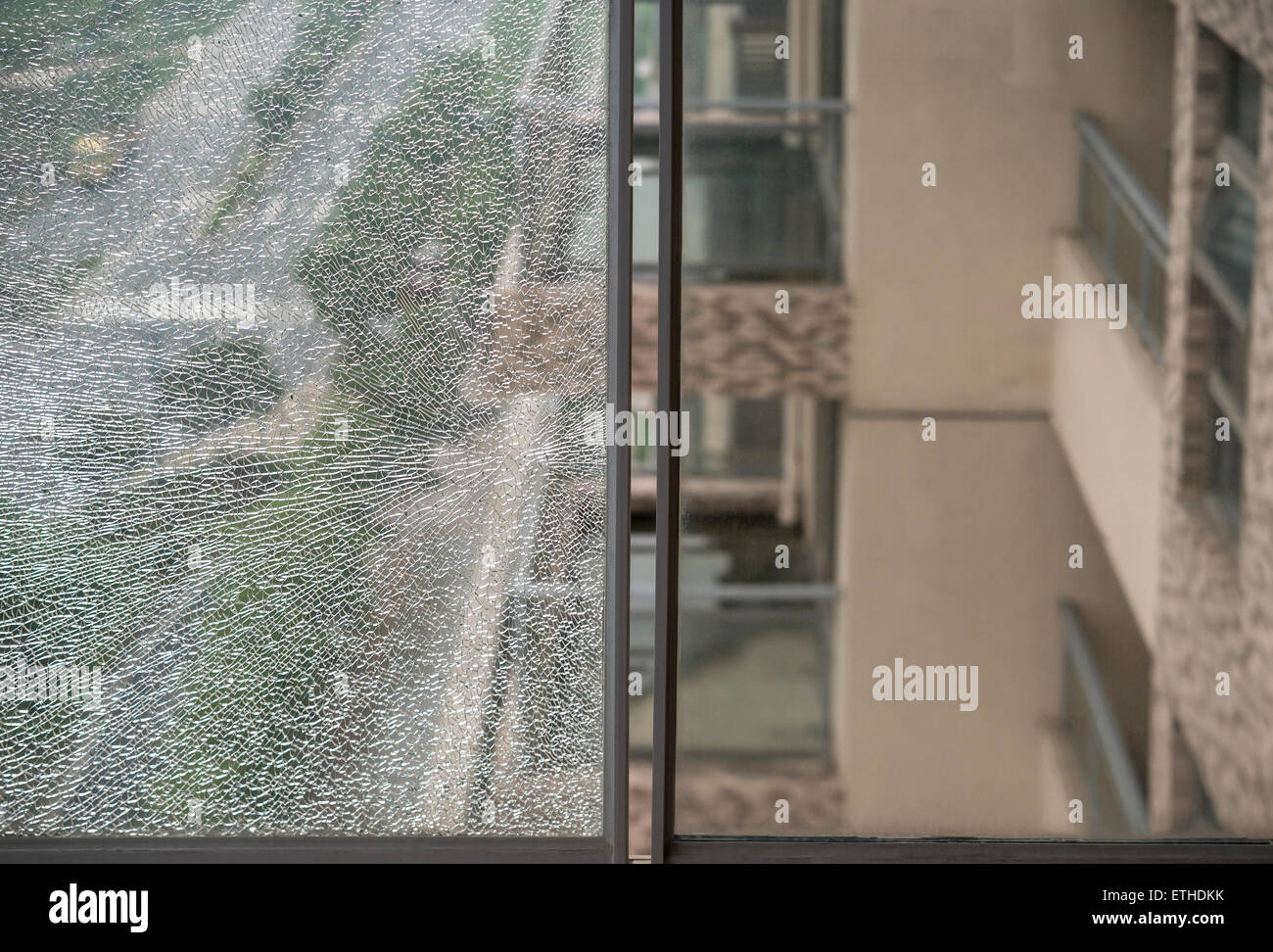 two glass windows with one broken and one intact Stock Photo - Alamy