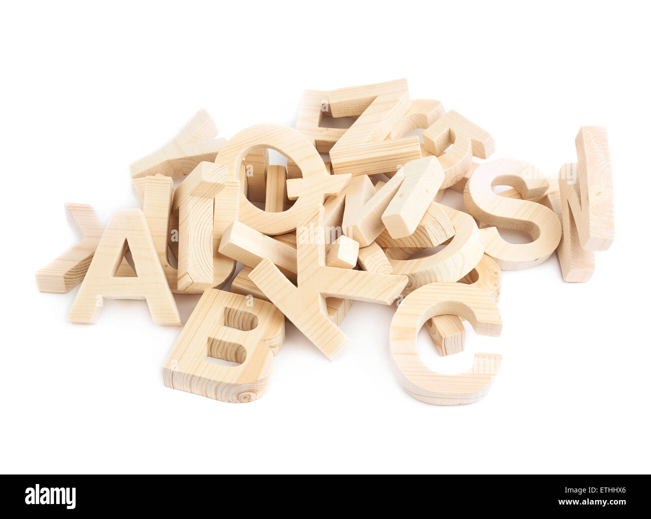 Pile of wooden block letters isolated Stock Photo - Alamy