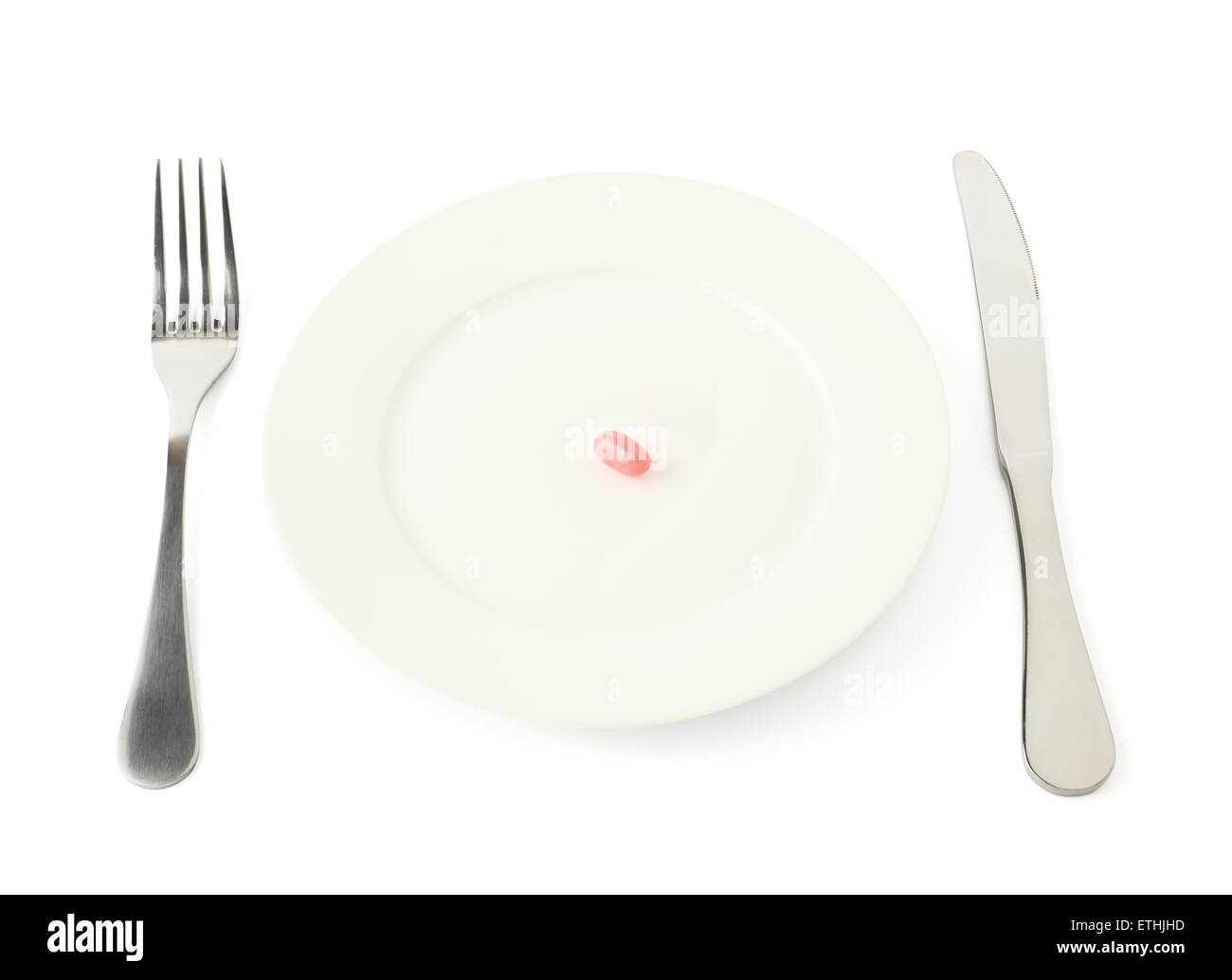 Single candy in a plate isolated Stock Photo - Alamy