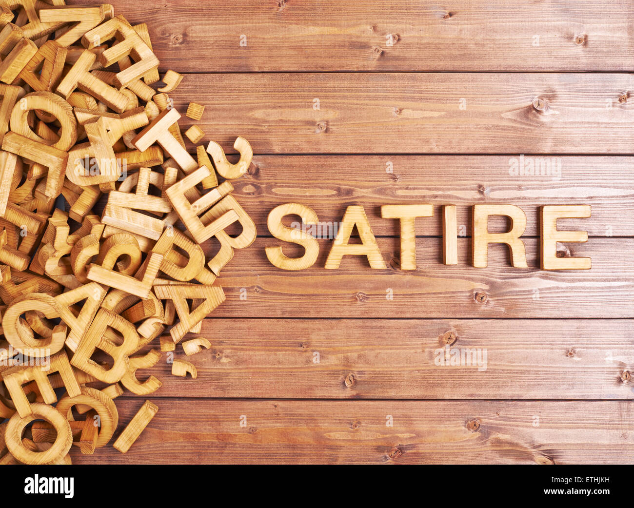Word satire made with wooden letters Stock Photo - Alamy