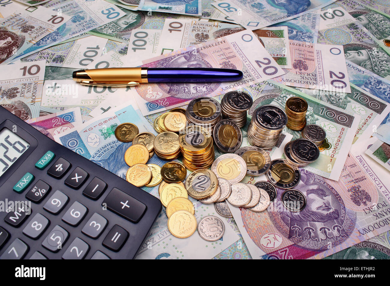 Polish money and calculator on money background Stock Photo - Alamy