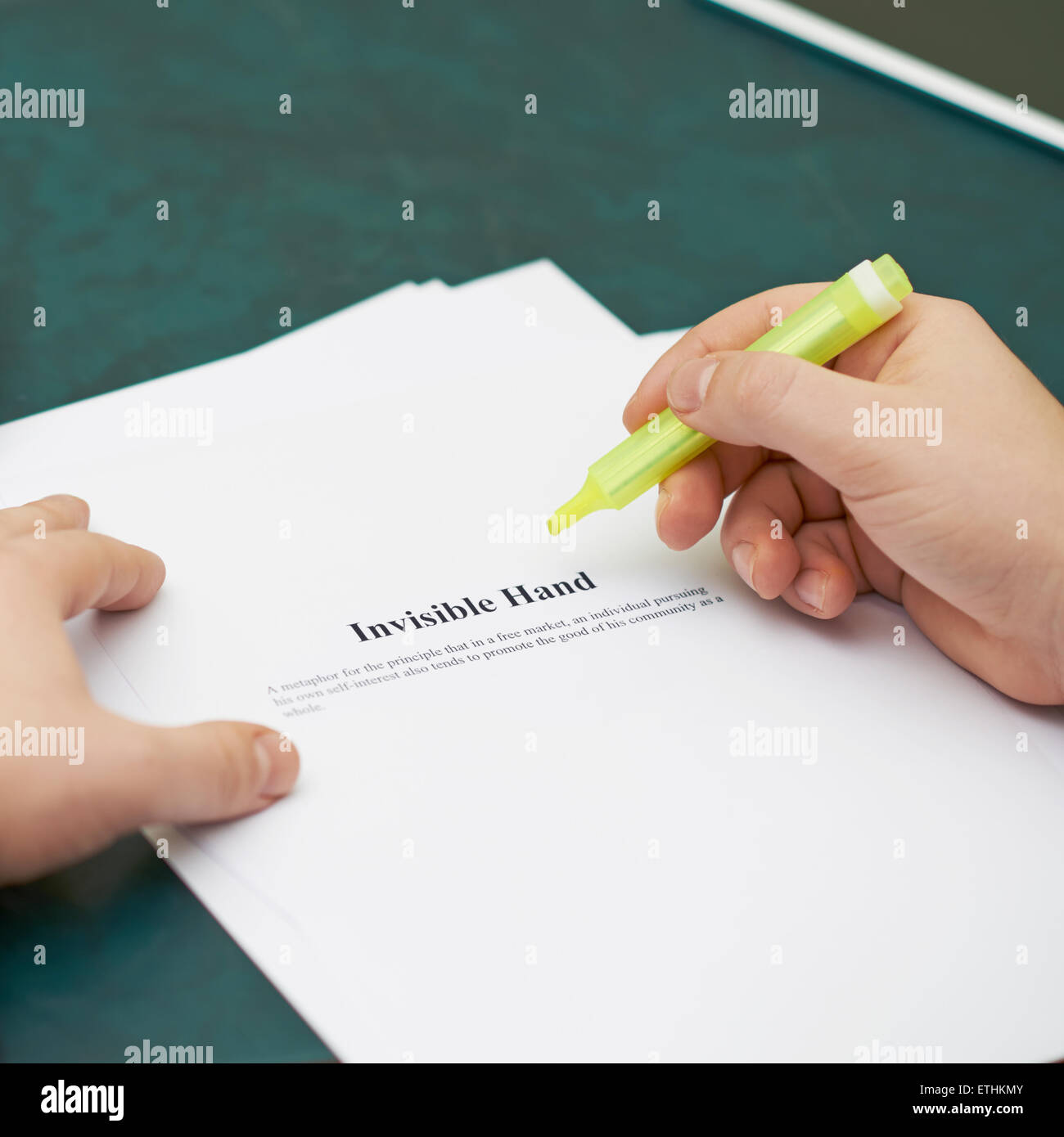 Marking words in an invisible hand definition Stock Photo - Alamy