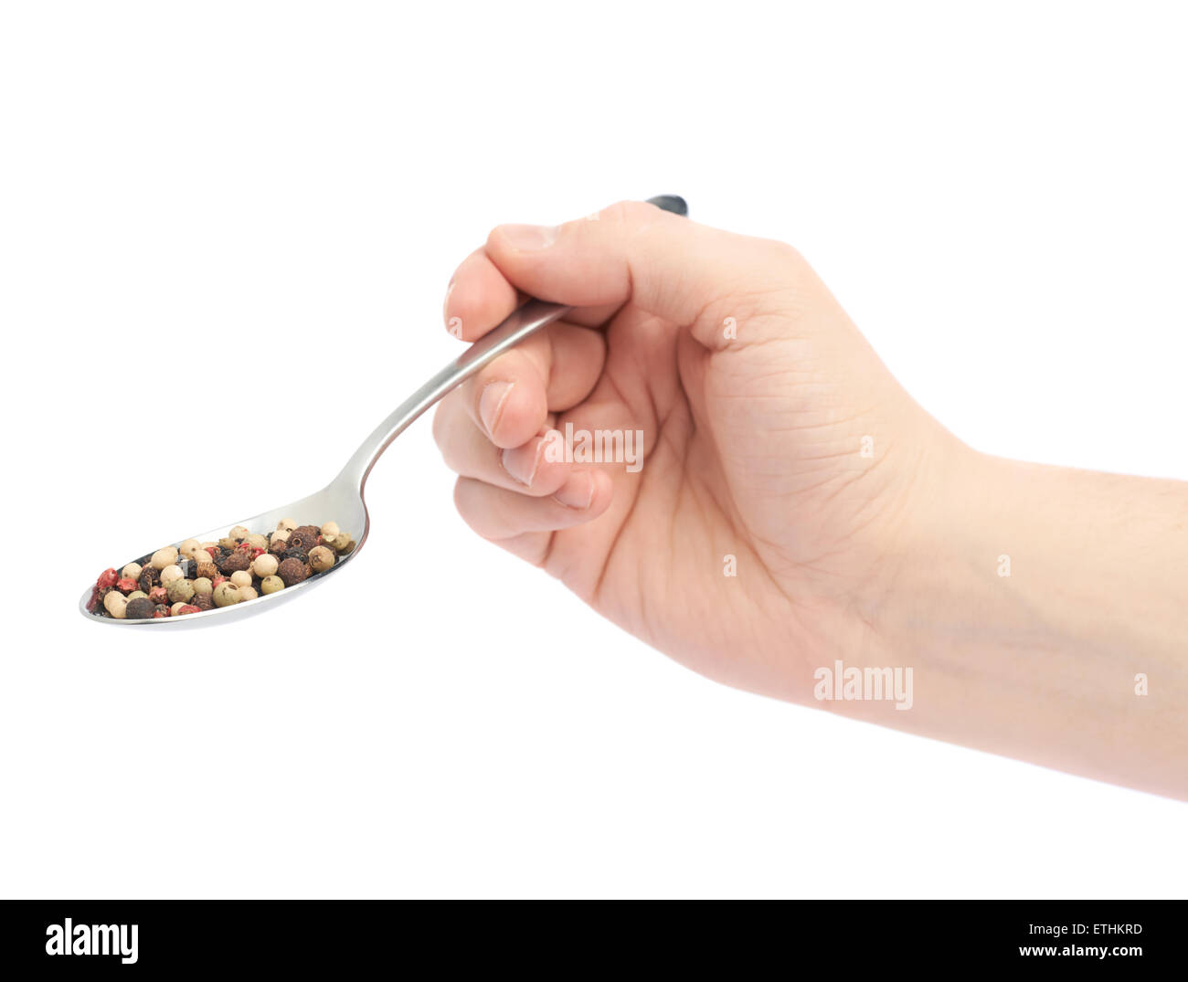 Hand holding silver spoon hi-res stock photography and images - Alamy