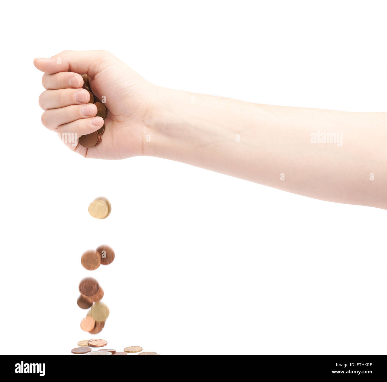 Hand dropping multiple change coins Stock Photo - Alamy