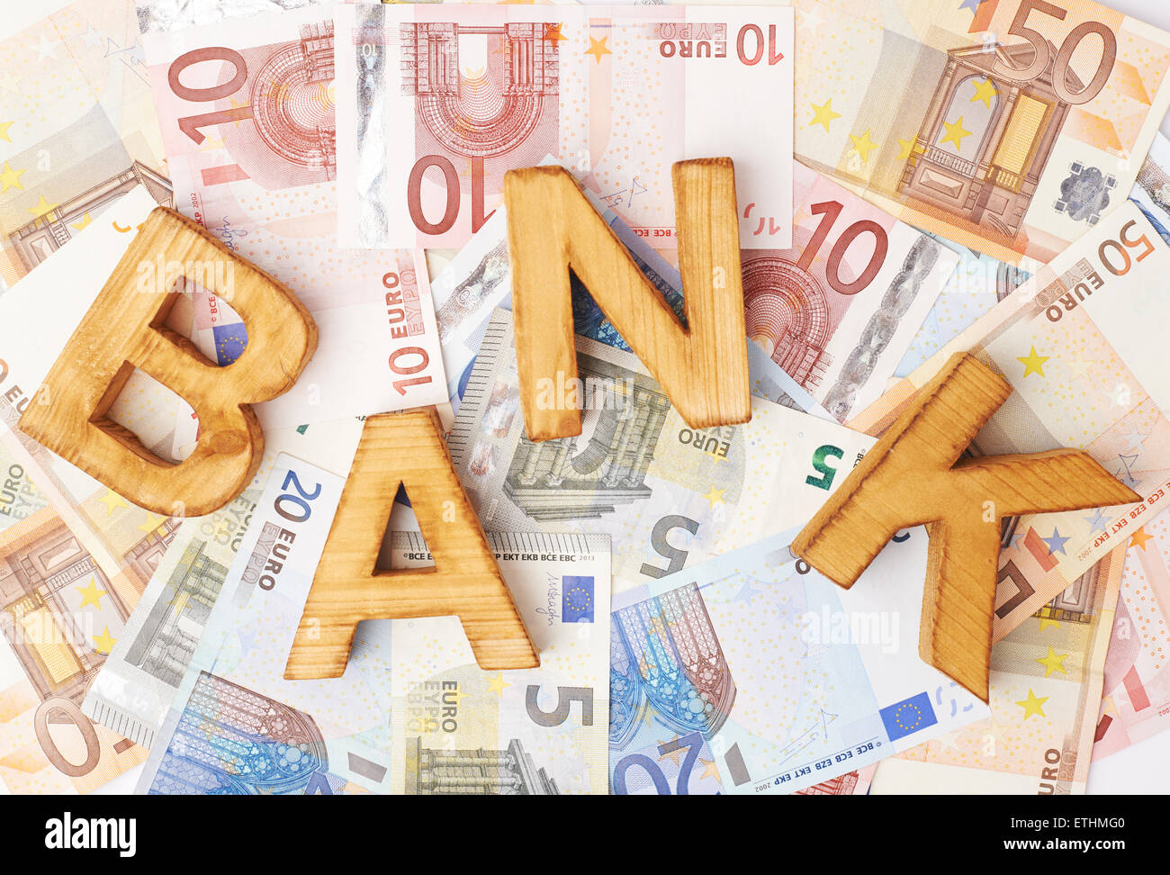 Word Bank over the pile of money Stock Photo - Alamy