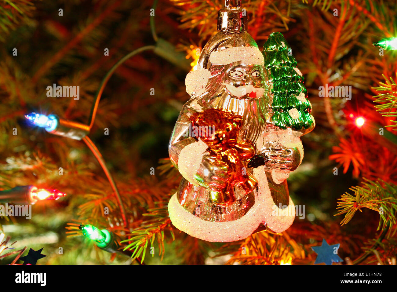 Santa Claus ornament hanging on the Christmas tree Stock Photo - Alamy