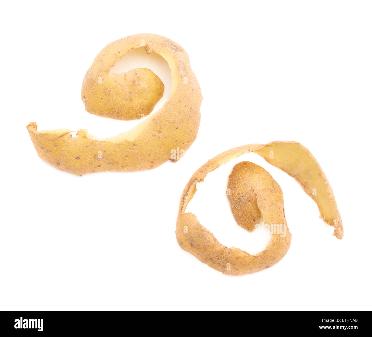 Two potato peel pieces isolated Stock Photo - Alamy