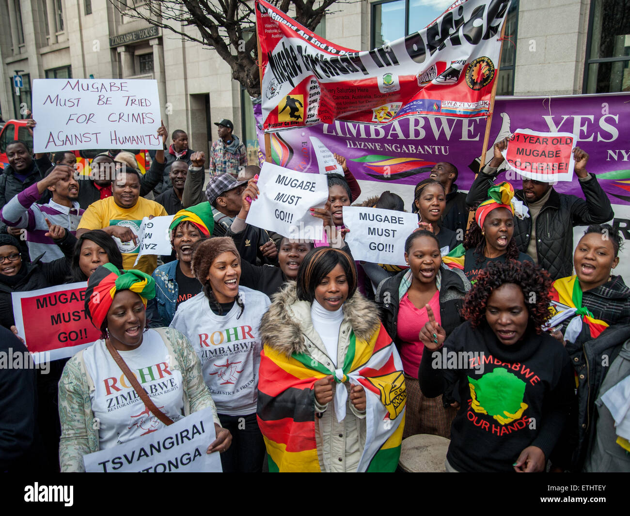 Activists protest outside the Zimbabwean Embassy in London against ...