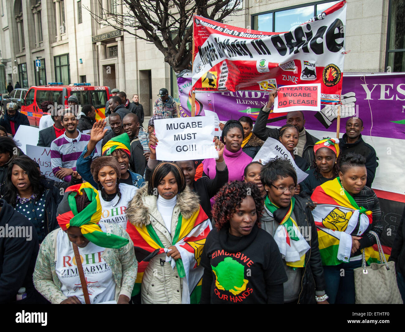Activists protest outside the Zimbabwean Embassy in London against ...