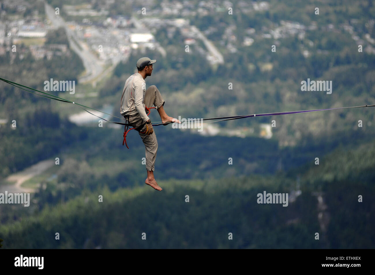 Squamish, Canada. 13th June, 2015. An adventure athlete walks the ...